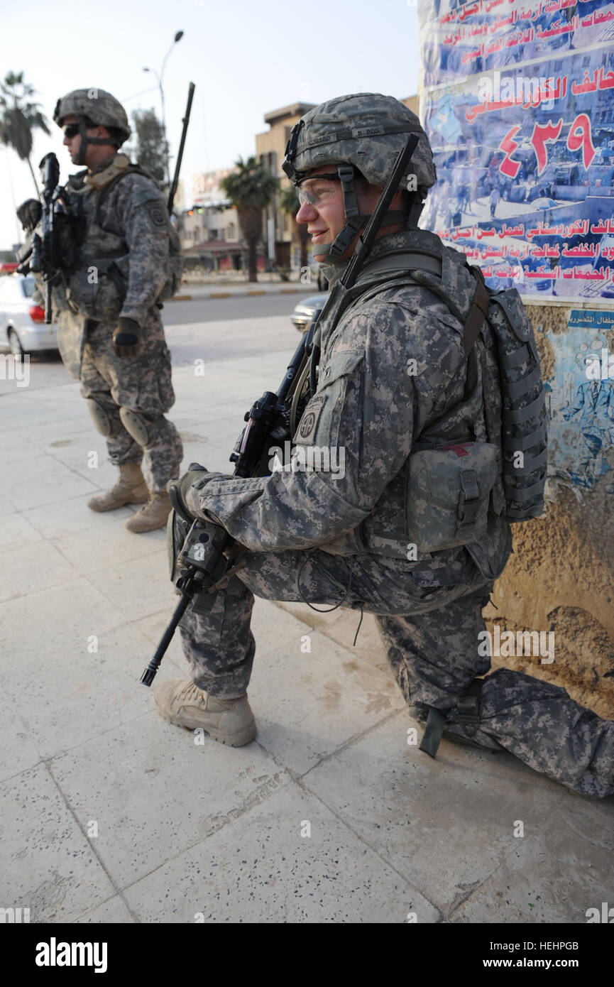 U.S. Army Soldiers provide security and assist Iraqi police at traffic ...