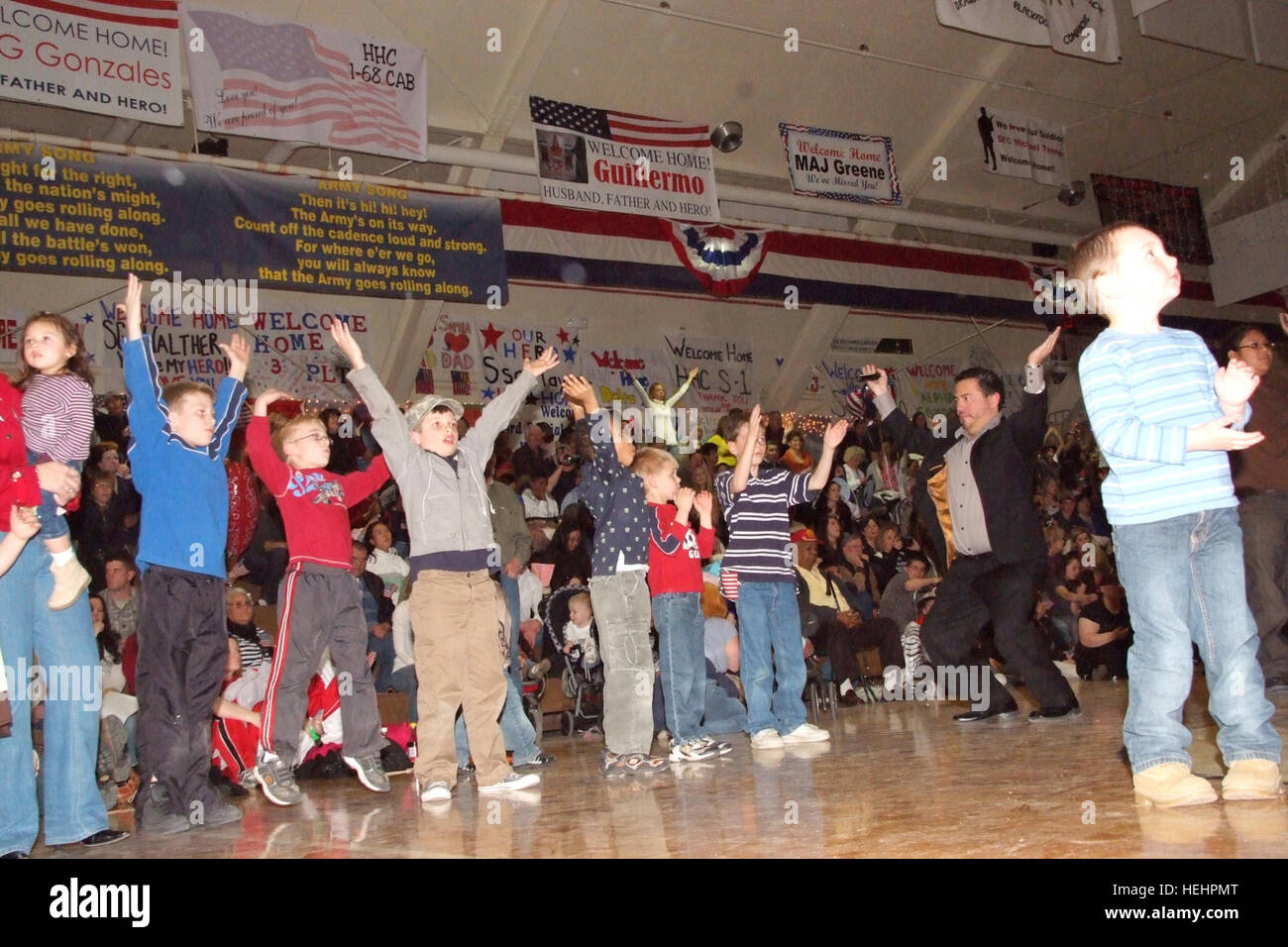 Fort Carson USO Program Manager Phil Martinez, right, leads Family and ...