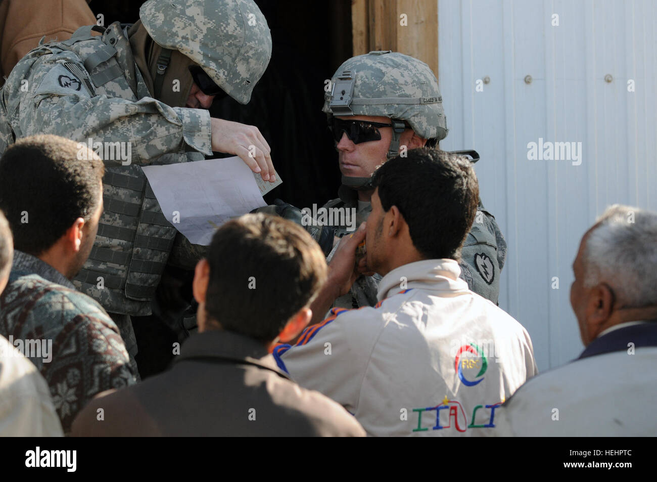 U.S. Army personnel verify the names of electrical engineers at the ...