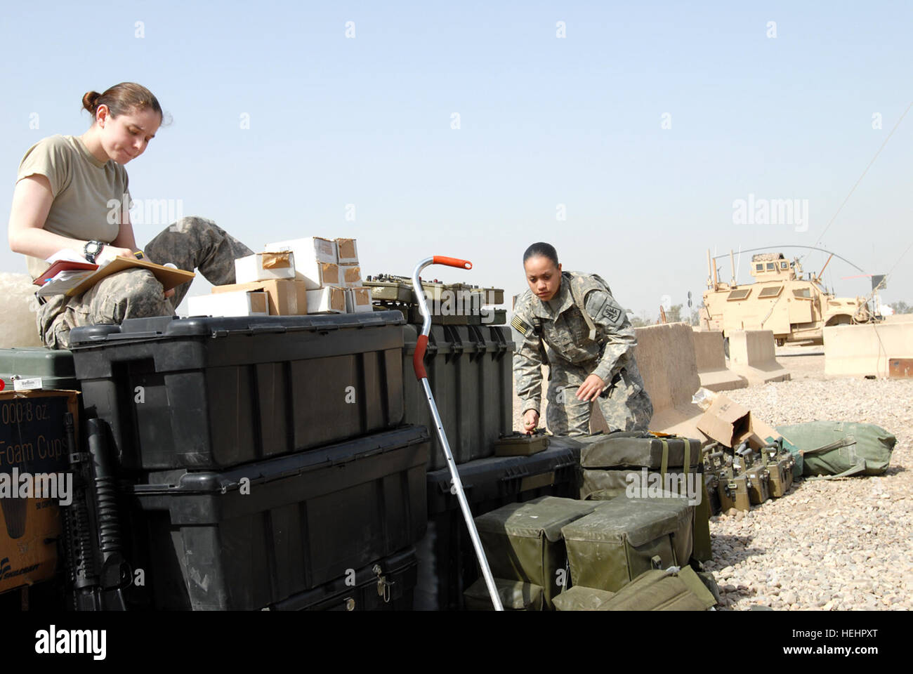 After arriving to Camp Liberty, Spc. Nicole Delia (left), of Clifton ...