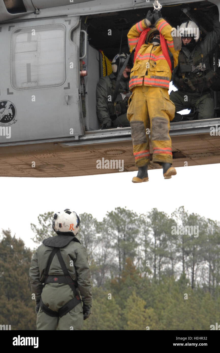 U.S. Navy crewman from Helicopter Sea Center 26, Norfolk, Va., hoists ...