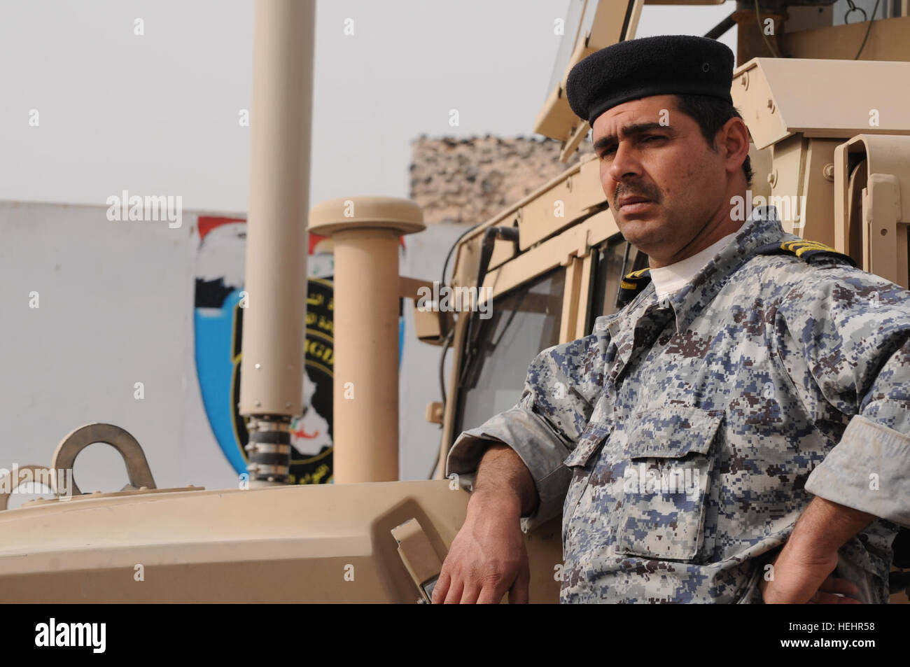 An Iraqi national policeman waits to begin Humvee mechanic's training ...