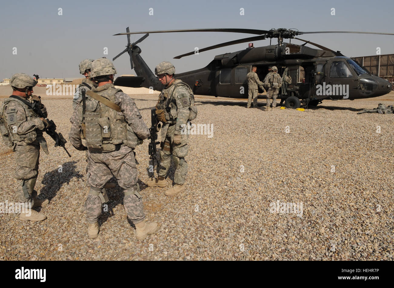 U.S. Army Sgt. Daniel Cooper (left), from Basehor, Kan., Staff Sgt ...