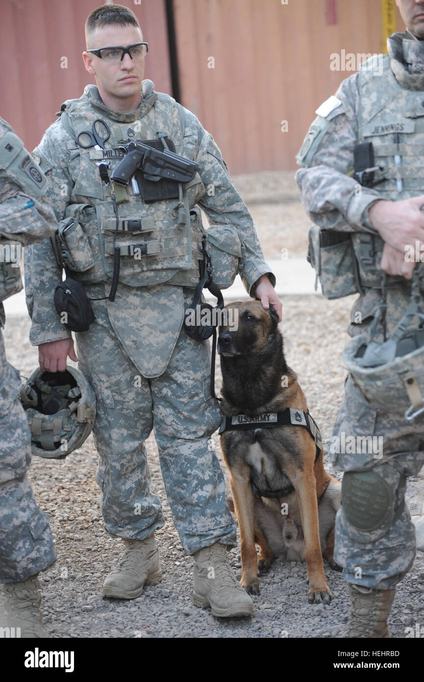 U.S. Army Staff Sgt. Nicholas Miller from Wichita, Kan., and Kandy, a ...