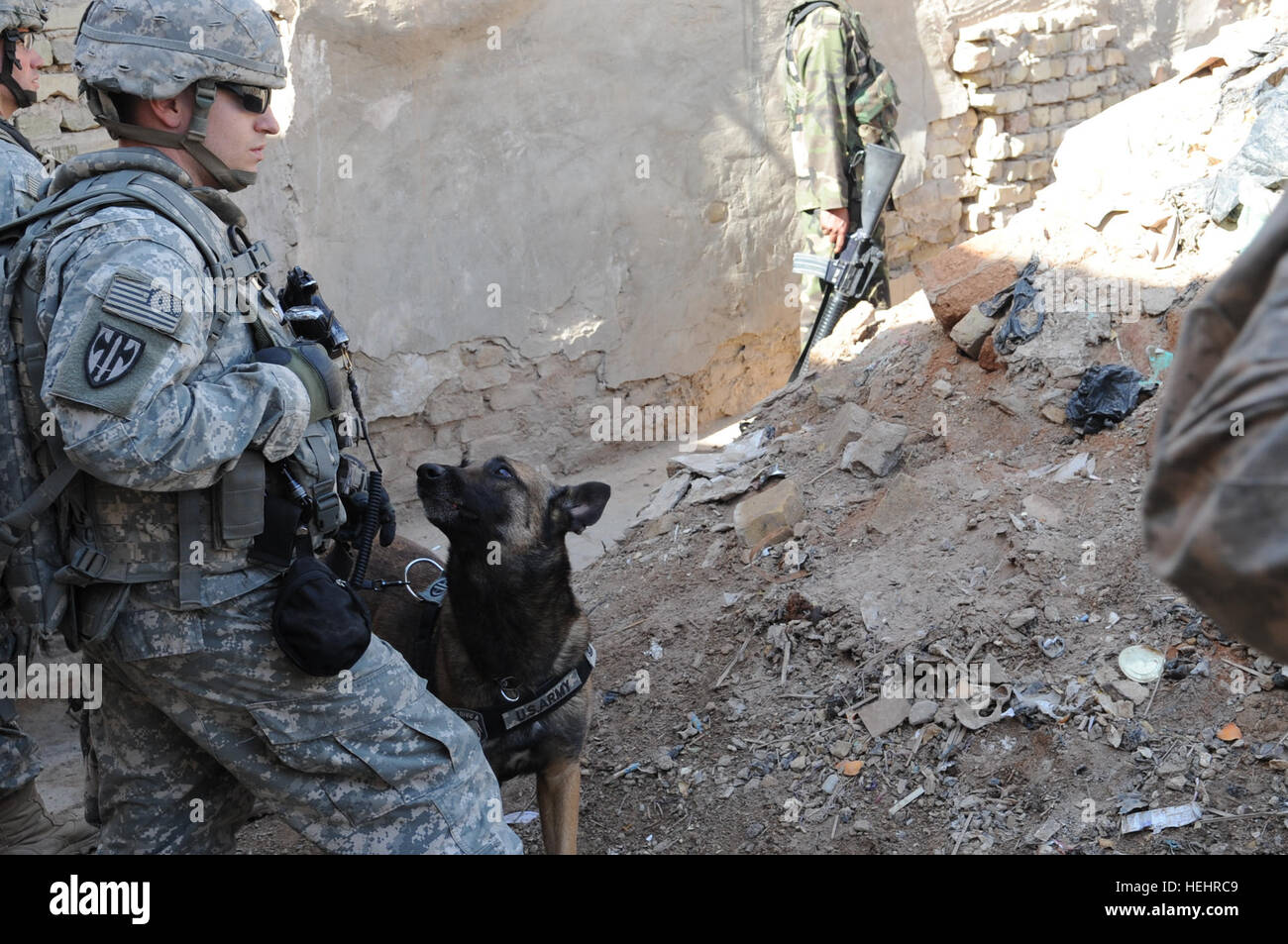U.S. Army Staff Sgt. Nicholas Miller from Wichita, Kan., and Kandy, a ...