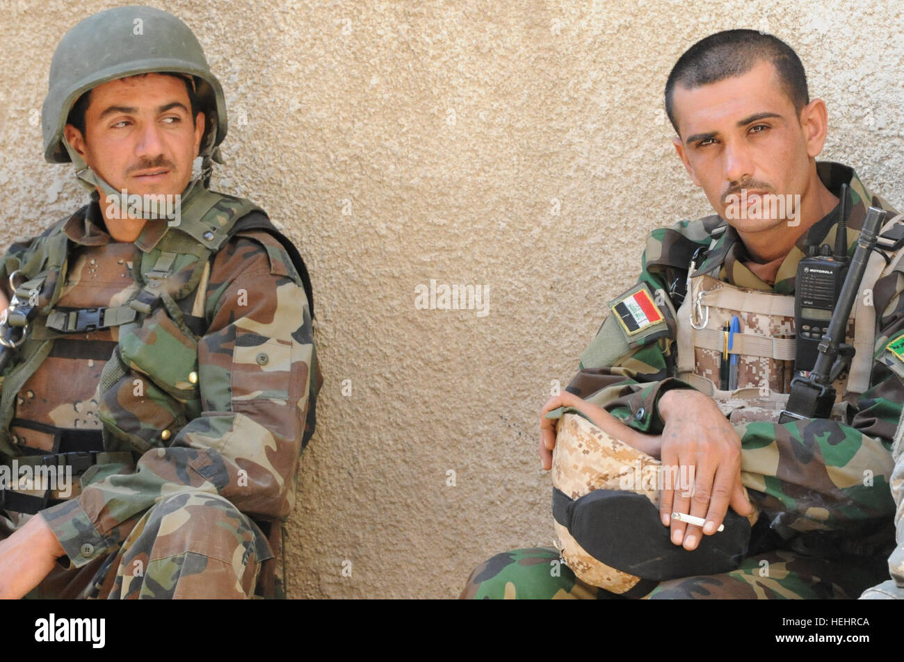 Iraqi soldiers wait to continue the mission during a joint operation ...