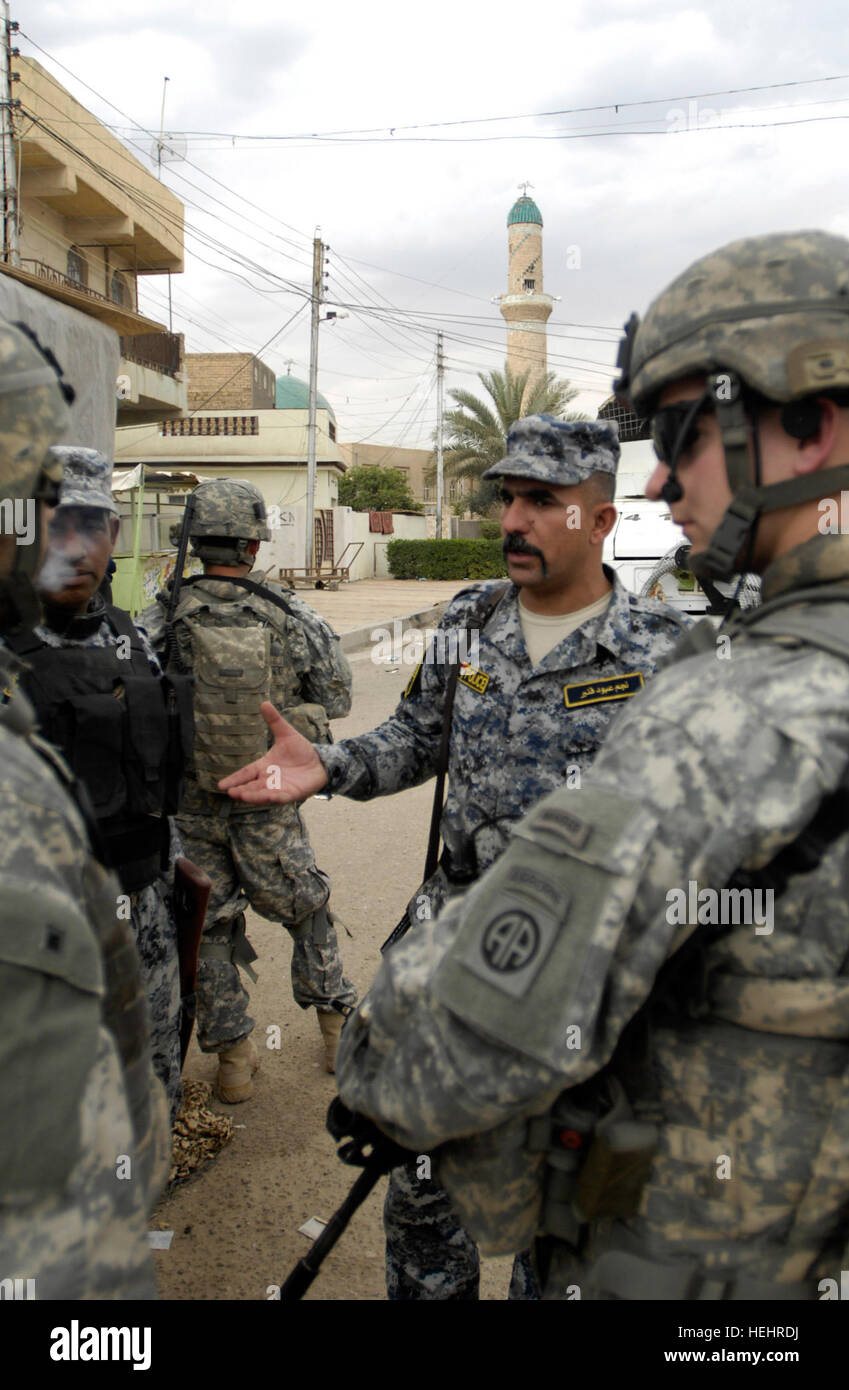 First Sgt. Nagim Abud Kanbar (center), 2nd Battalion, 7th Brigade, 2nd ...