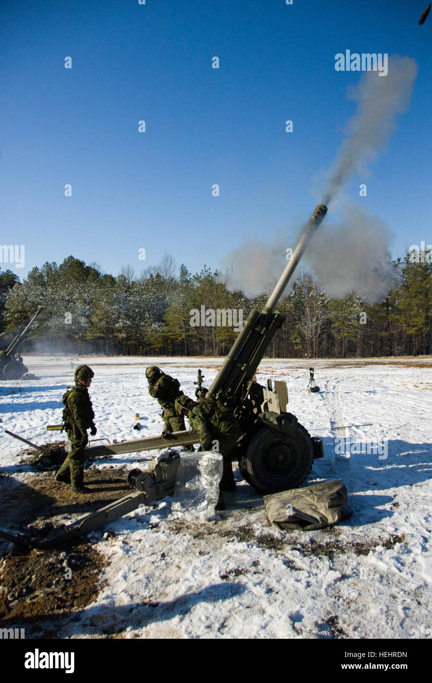 Canadian soldiers from the 1st and 3rd Field Regiments fire a 105 mm ...