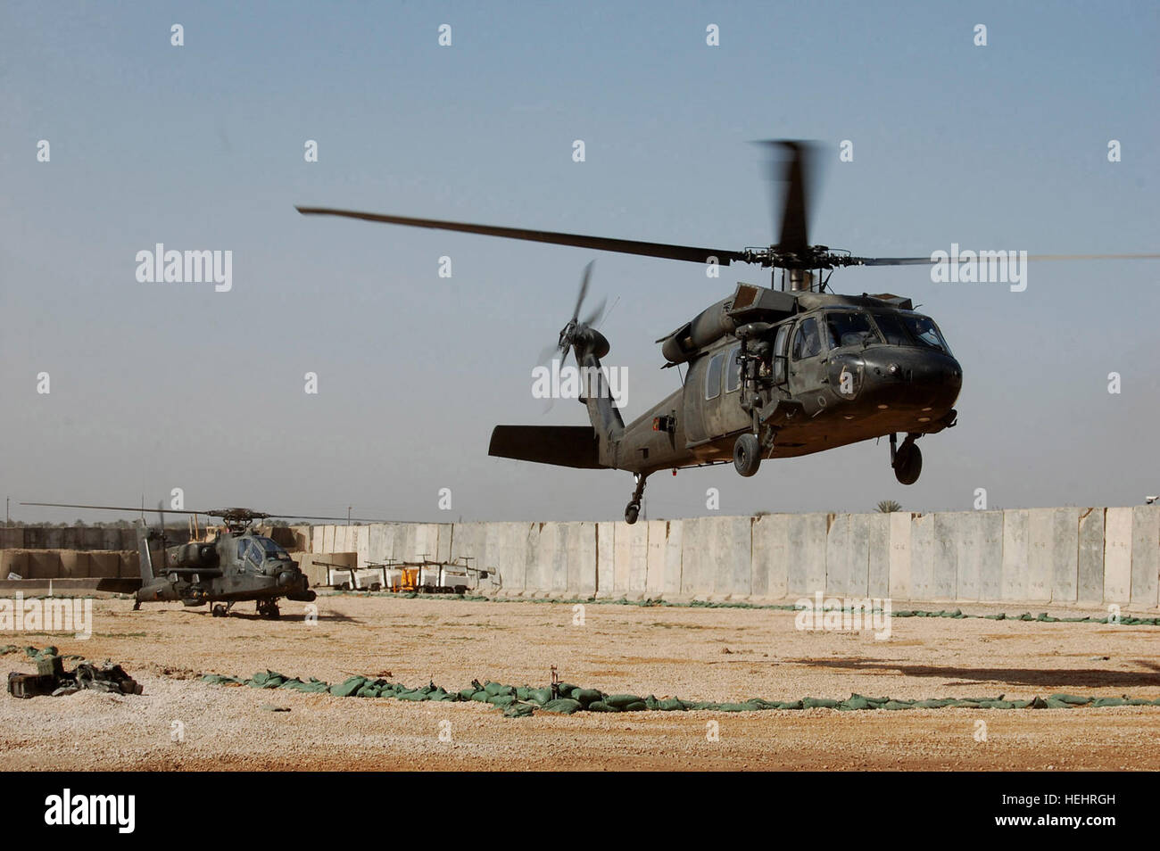CAMP TAJI, Iraq – A Blackhawk and Apache attack helicopter from the 3rd ...