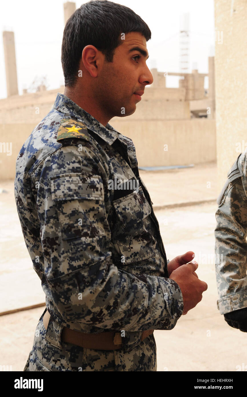 An Iraqi police 1st Lt. from the 7th IP Brigade, 2nd IP Division, gives ...