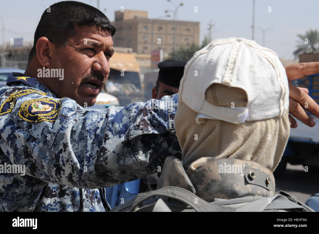 Lt. Col. Muhammed of the Iraqi national police, talks with Iraqi ...