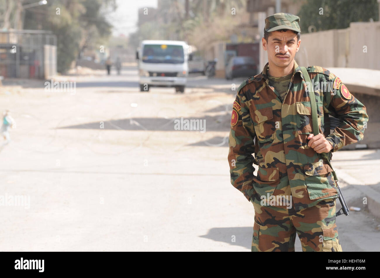 An Iraqi soldier stands at a checkpoint in Karada, eastern Baghdad ...
