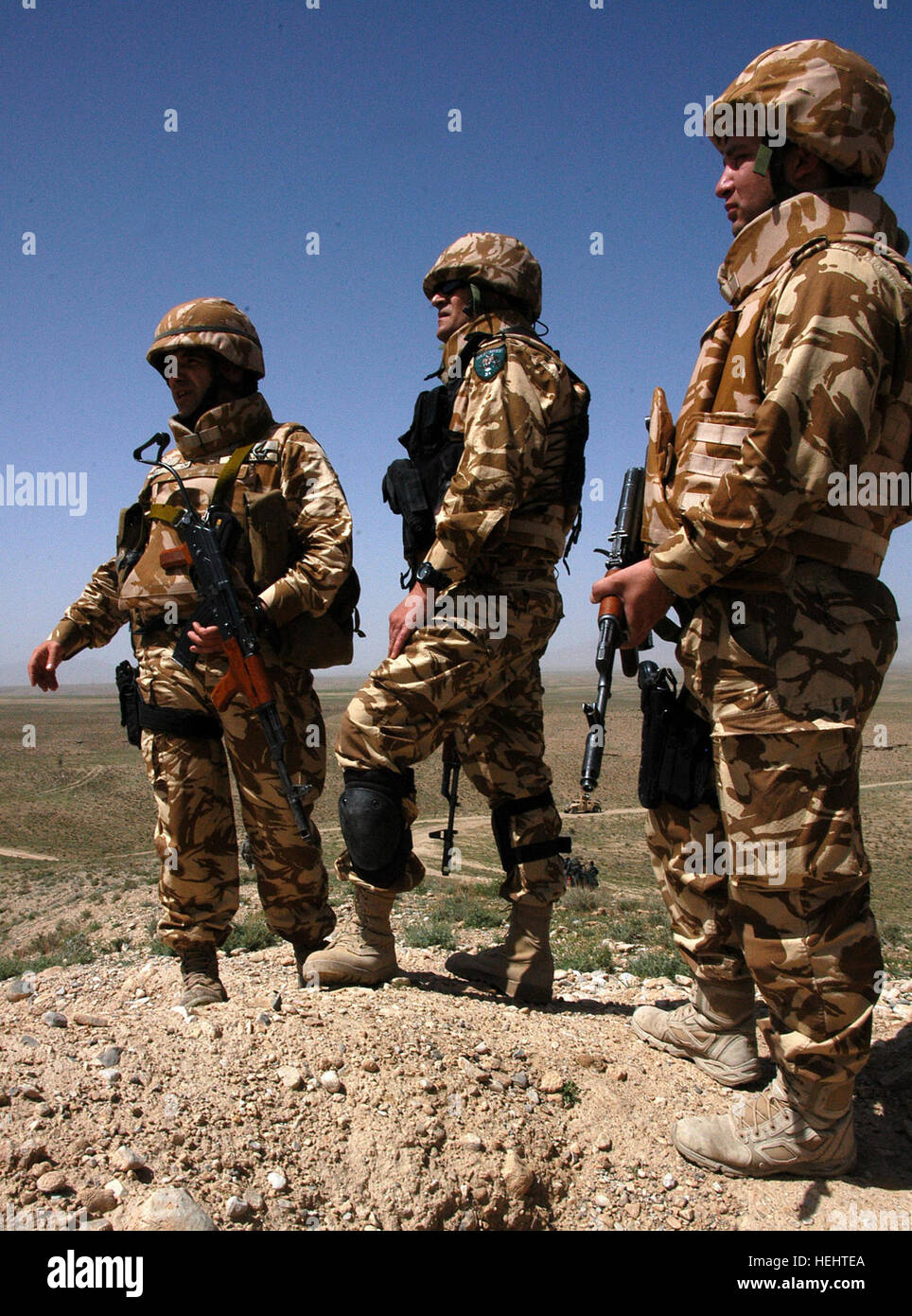 Romanian officers from the 21st Mountain Division conduct a site survey ...