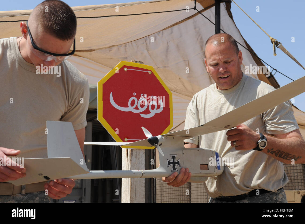 U.S. Army Pfc. Shawn Miller (left) from Visalia, Calif., and Sgt. 1st ...