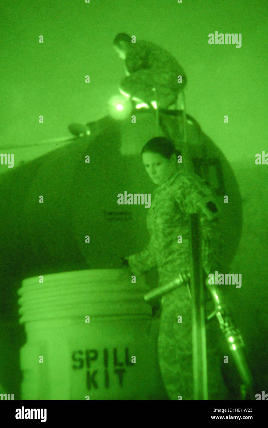 As seen through a night vision lens, Spc. Lisa Horan of Chambersburg ...