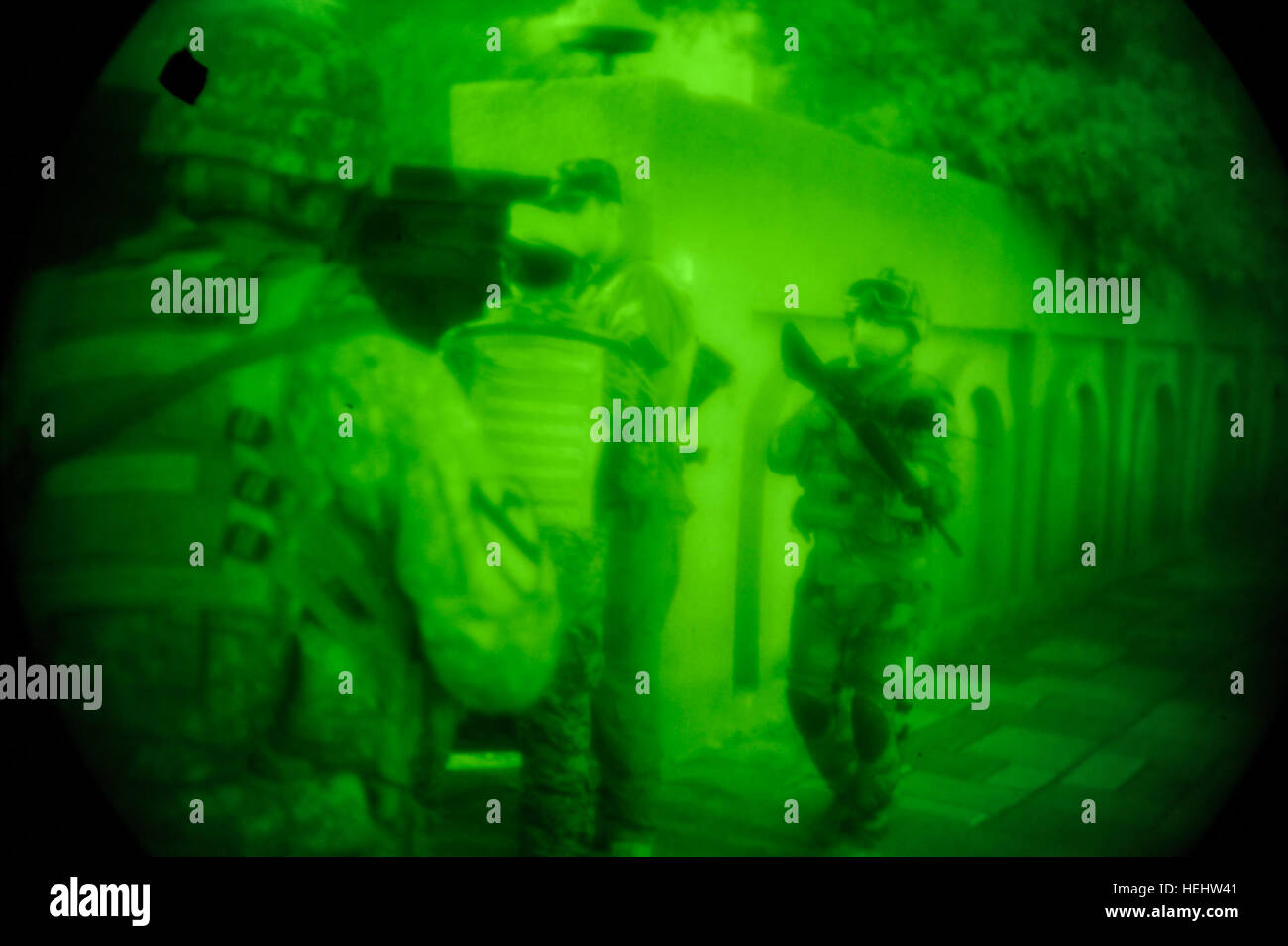 U.S. and Iraqi Soldiers conduct a cordon and search operation in a ...