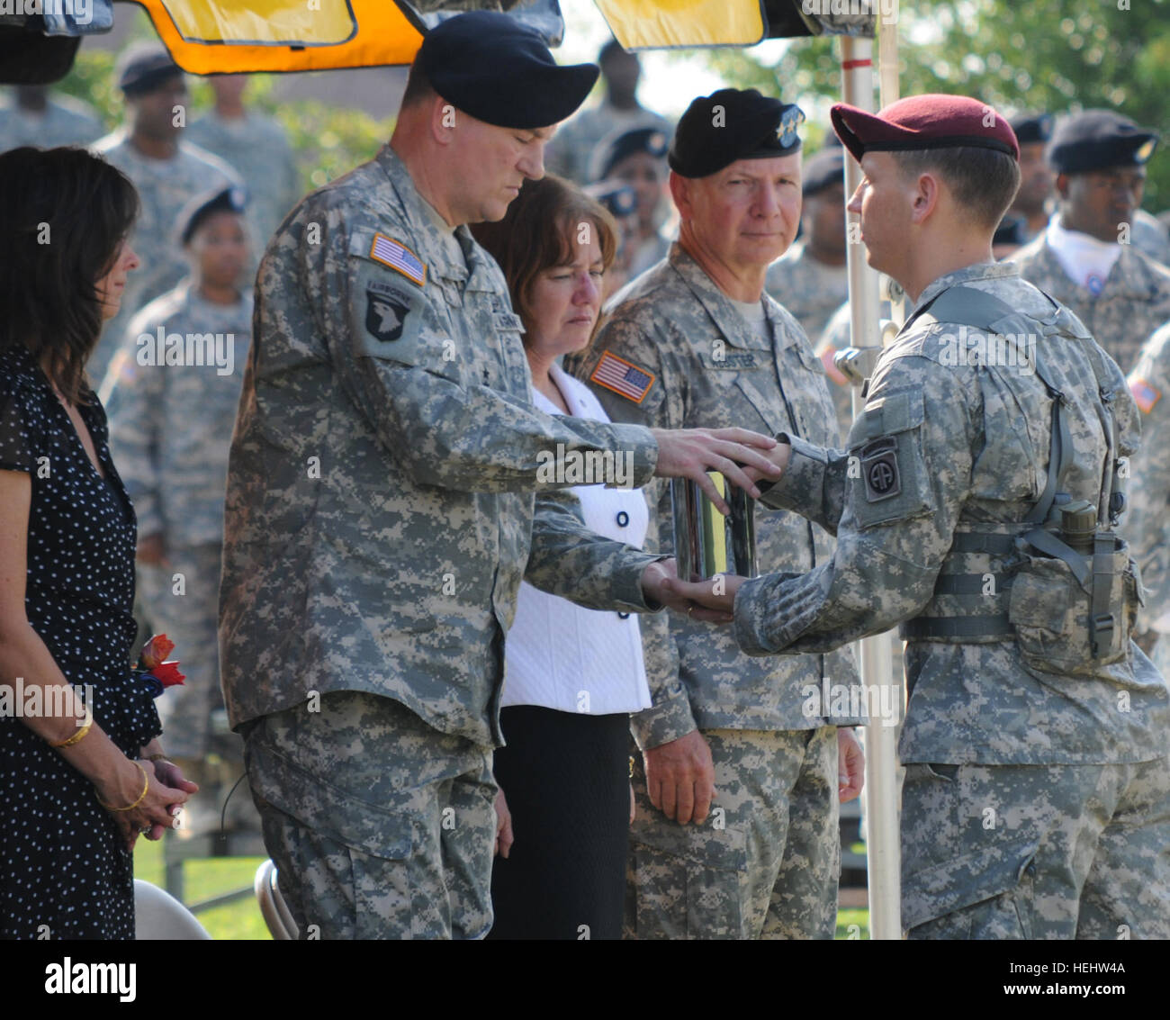 Maj. Gen. James E. Rogers, out-going command general, receives a 105 mm ...