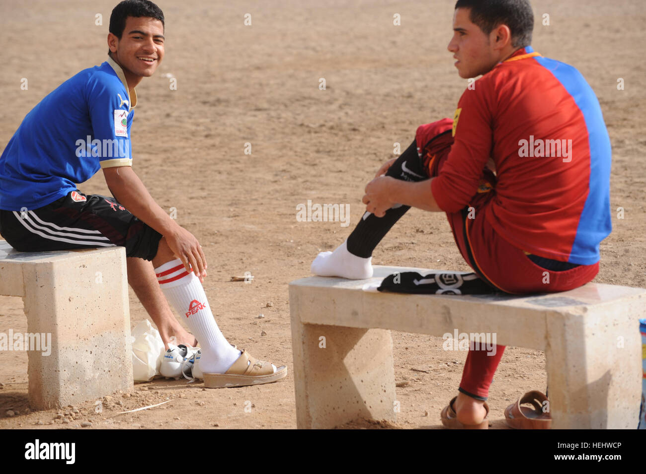 Iraqi soccer players get ready for the game at a soccer field in the Al ...