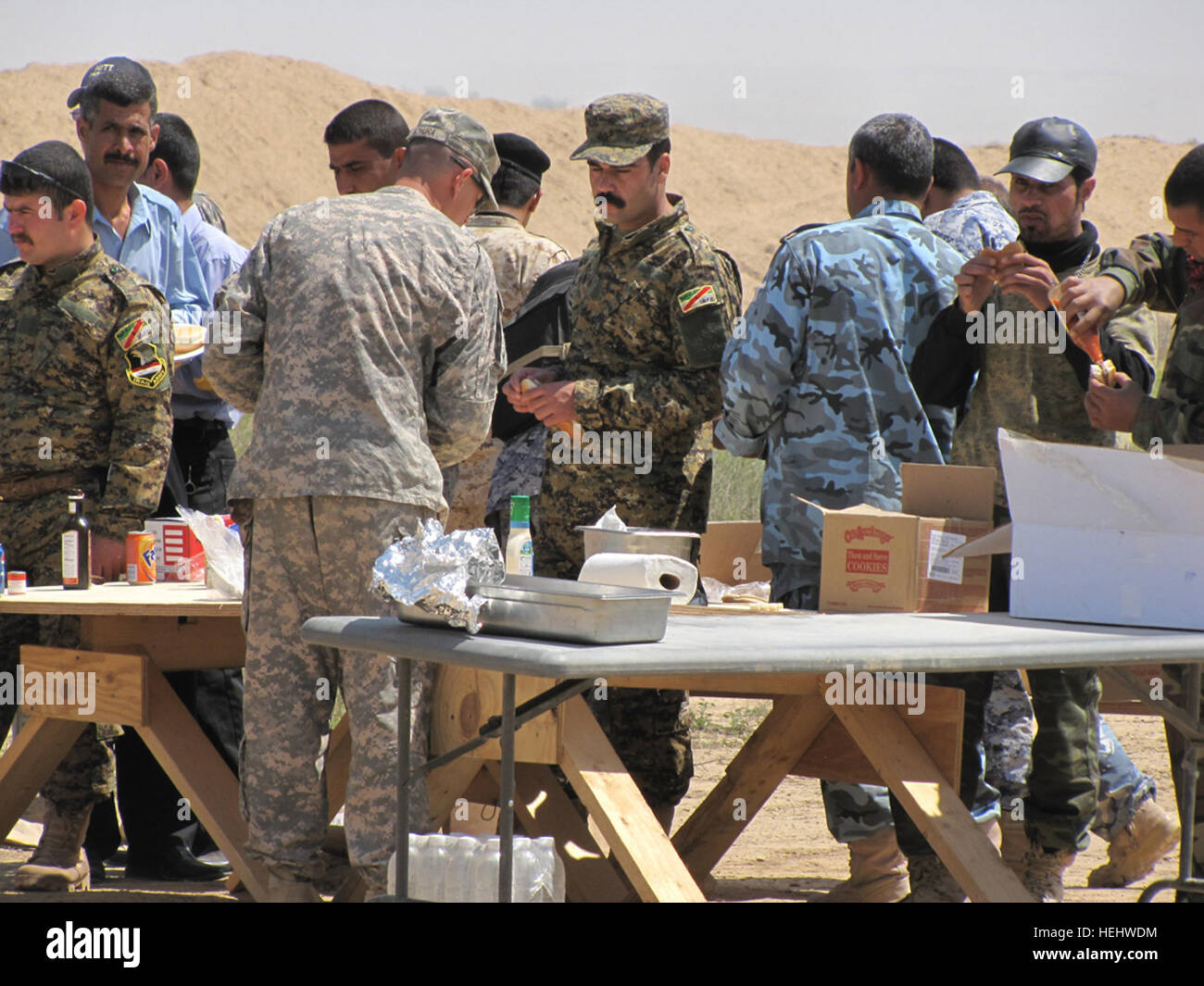 Iraqi soldiers, police and members of the U.S. Army take a break for ...