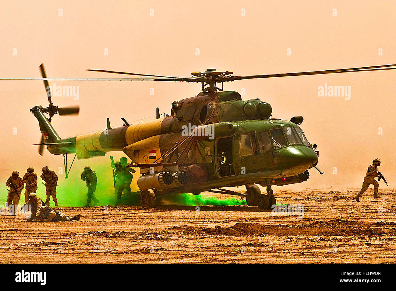 Iraqi Soldiers exit an Iraqi Air Force helicopter during the Combined ...