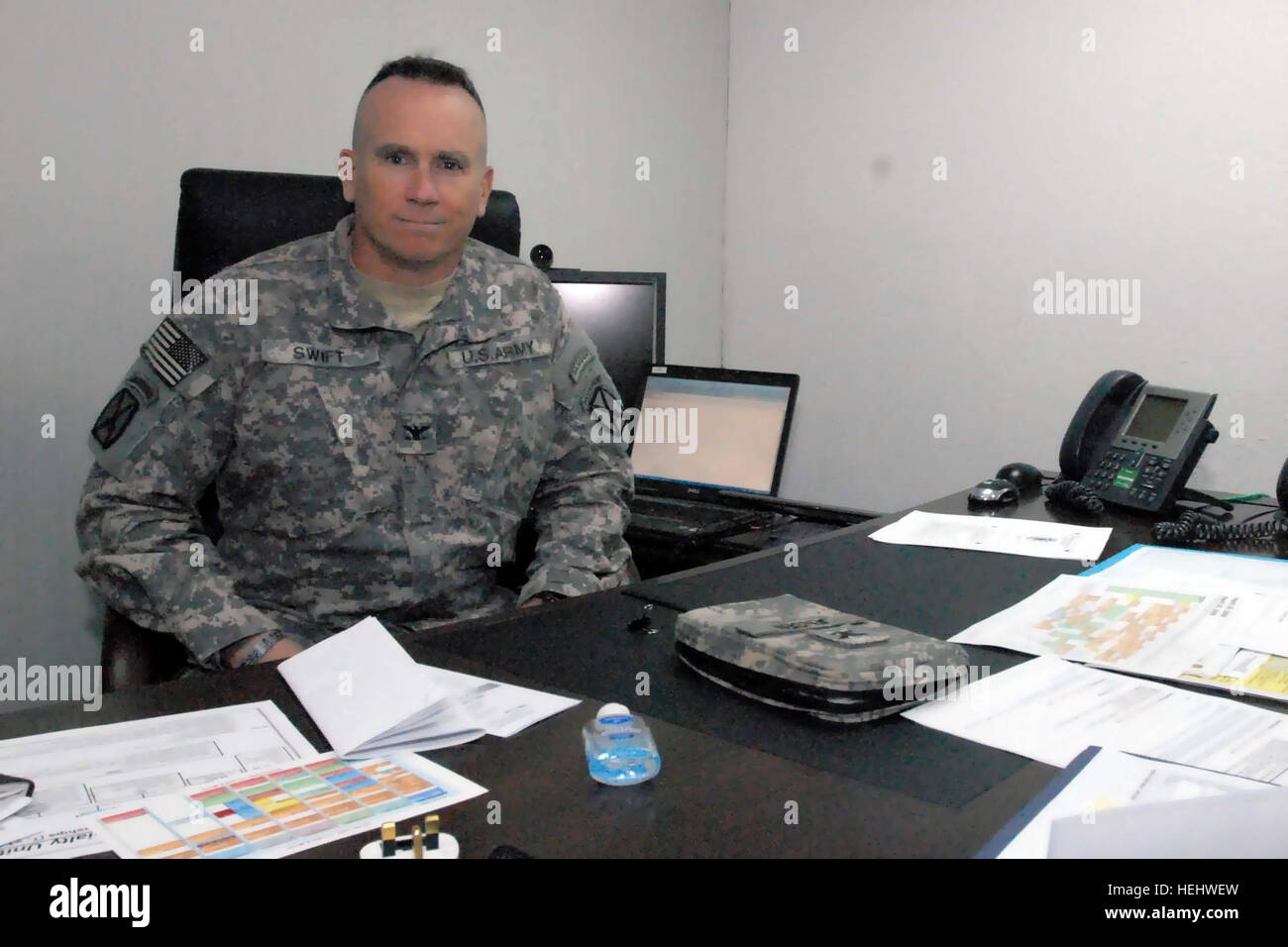 Col. Larry Swift, 10th Mountain Division chief of operations, sits at ...