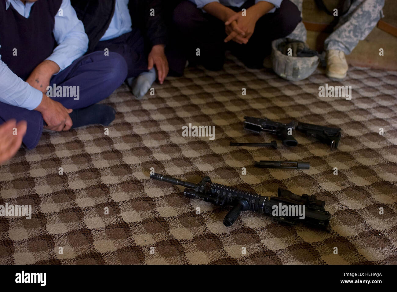 Iraqi police officers participate in an M4 familiarization class given ...