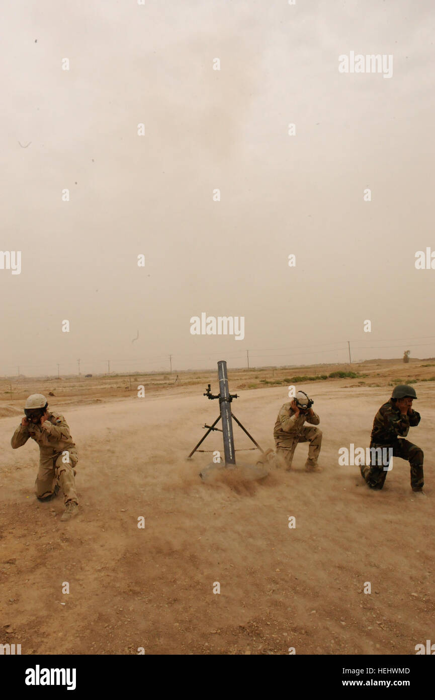 Iraqi soldiers from Mortar Battery, 142nd Iraqi Army Brigade, fire the ...
