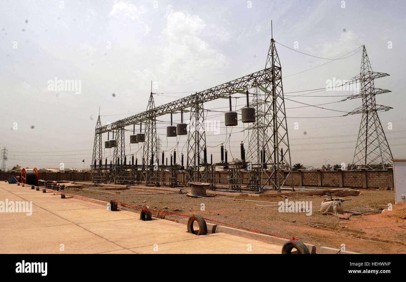 New electrical transformers stand ready to be put into use, at a newly ...