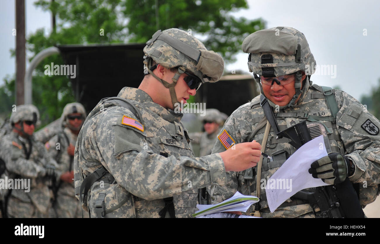 1st Lt. John Avery of Fountain, Colo., (left) and Staff Sgt. Albert ...