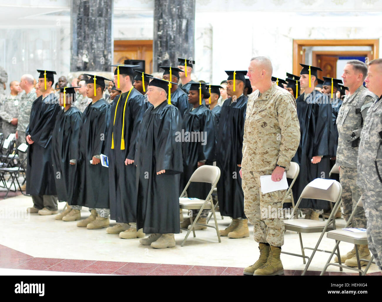 Service members participate in a graduation ceremony held at the Al Faw ...