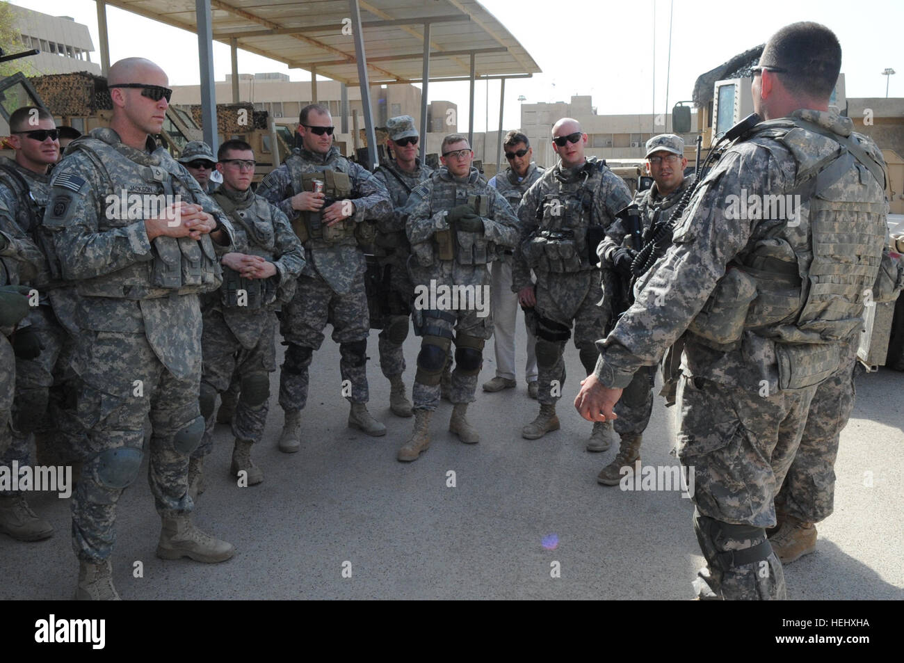 U.S. Army Sgt. 1st Class Donald Workman from Gainsville, Fla., briefs ...