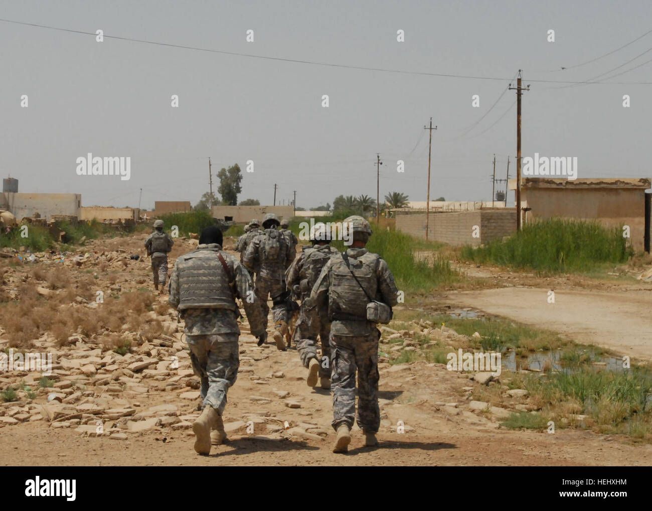 An interpreter and Soldiers of Company B, 2nd Battalion, 112th Infantry ...