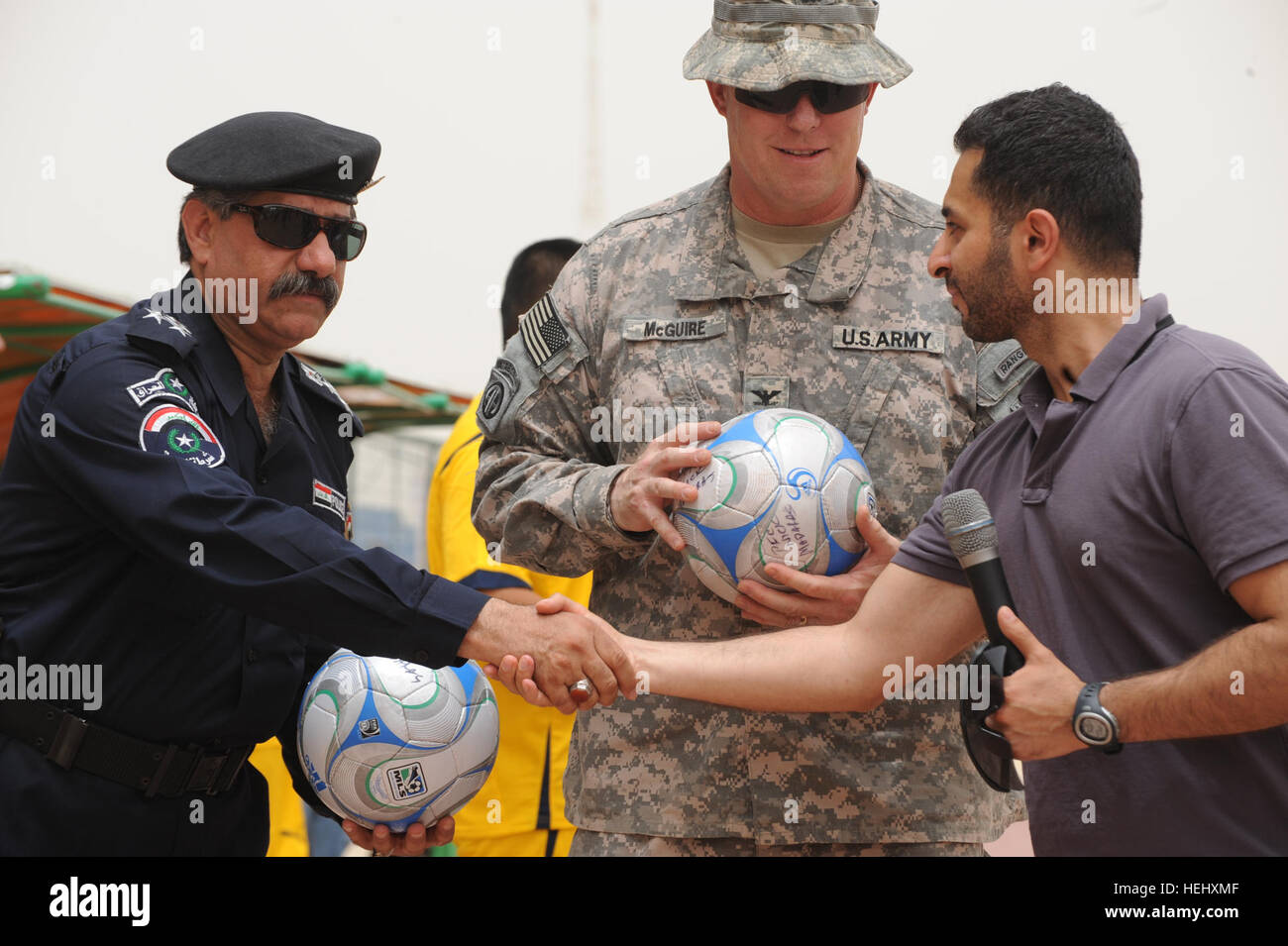 Iraqi Police Brigadier General Latif shakes hands with the chief ...