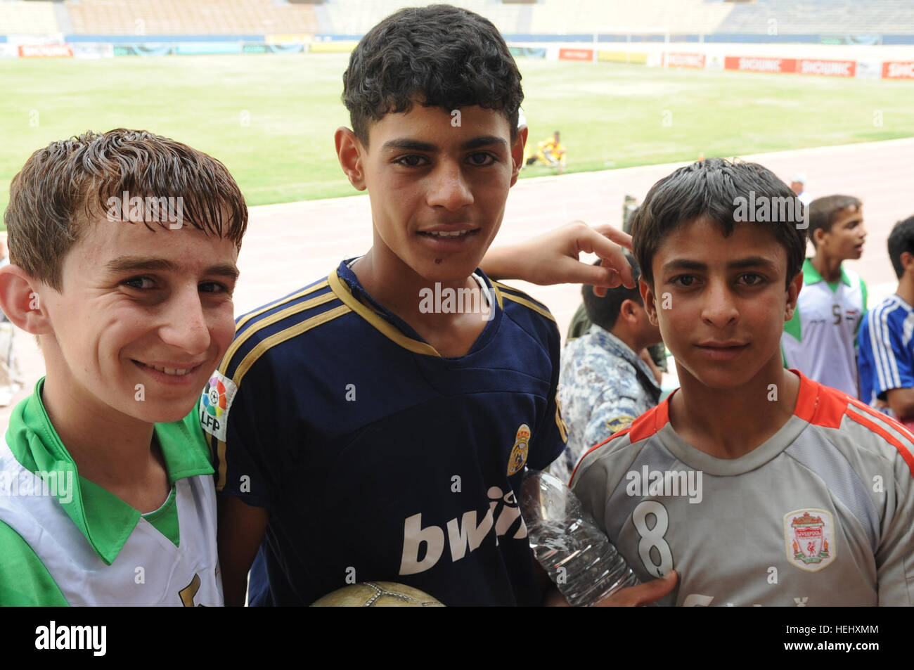 Iraqi boys pose for a photograph in the viewing stands at Sha'ab ...