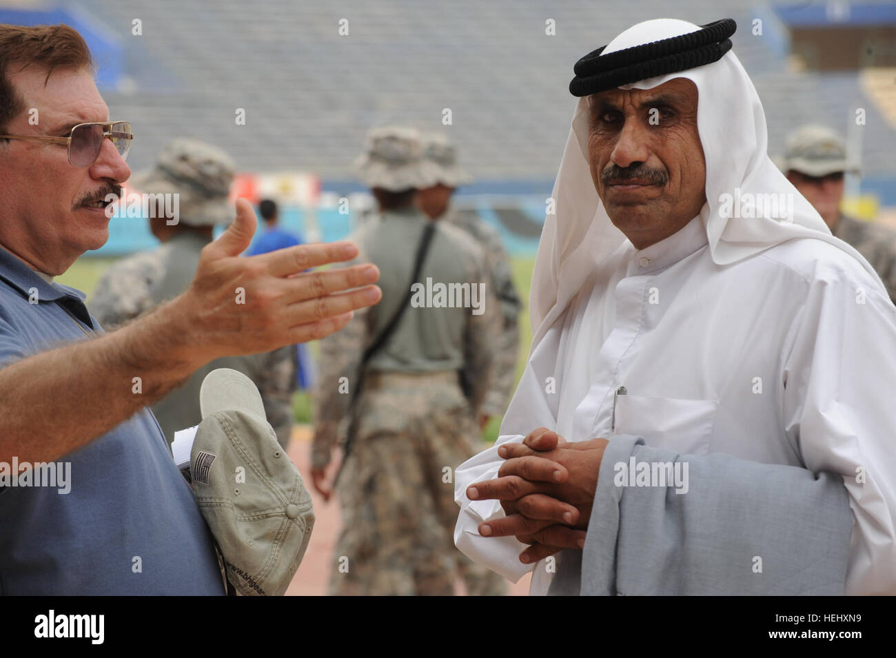 A local sheik stands on the sidelines at Sha'ab stadium in eastern ...