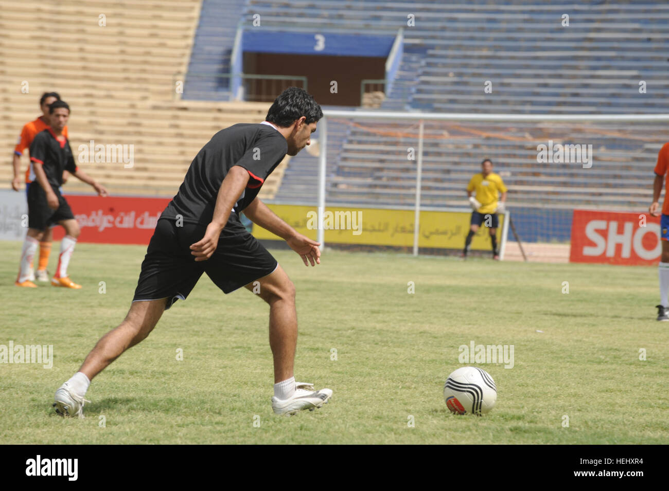 An Iraqi soccer player prepares to make a kick during an Iraqi ...