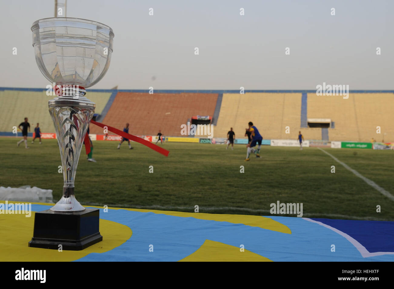 A trophy sits on a table on the sidelines during an Iraqi community ...