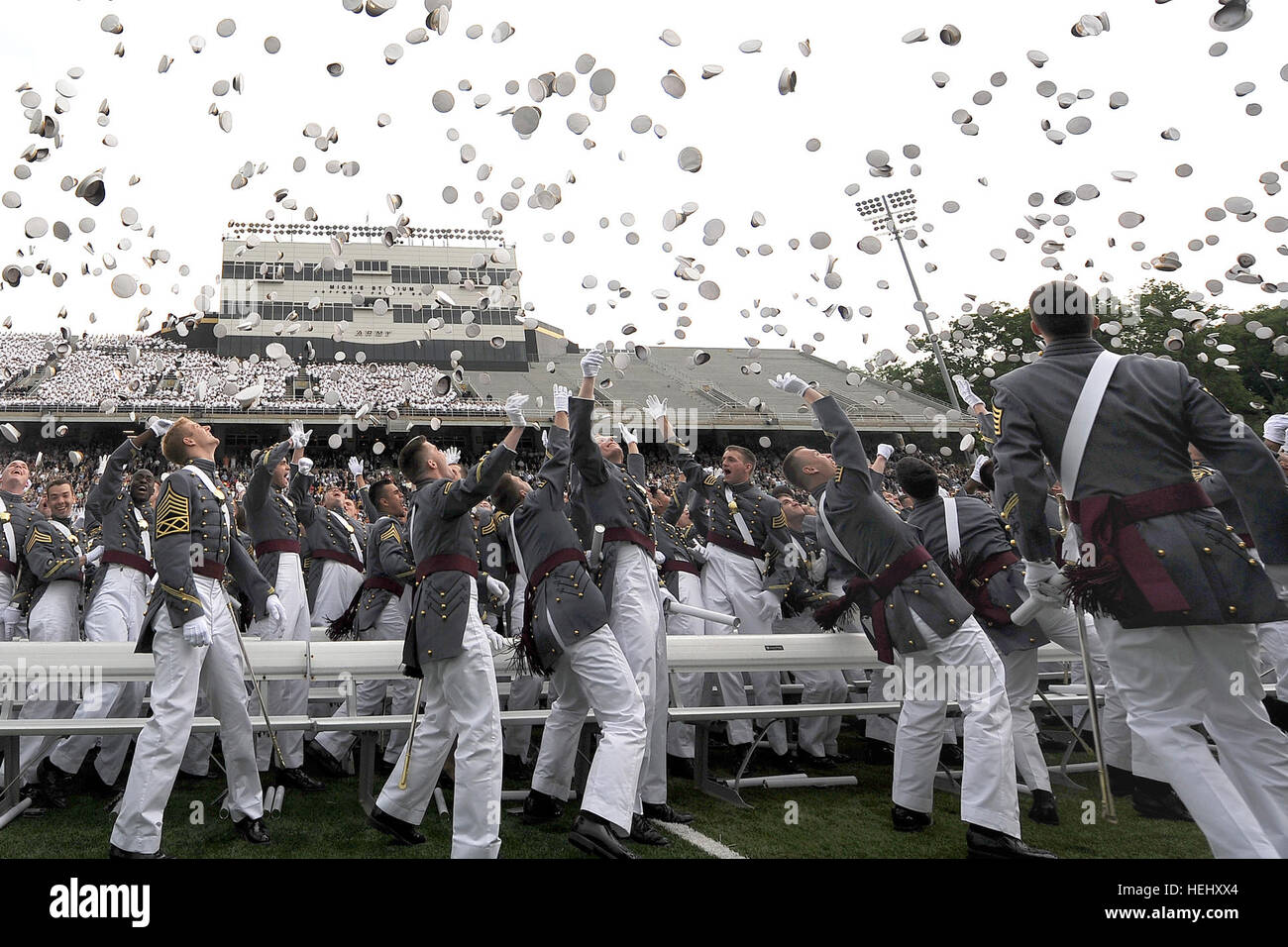 U.S. Military Academy graduates toss their hats during the Commencement ...