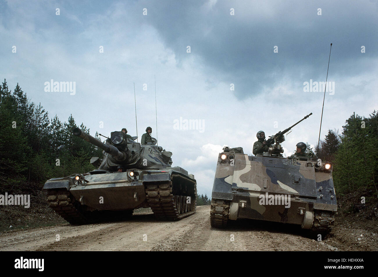 An M113 armored personnel carrier and an M60 main battle tank on ...