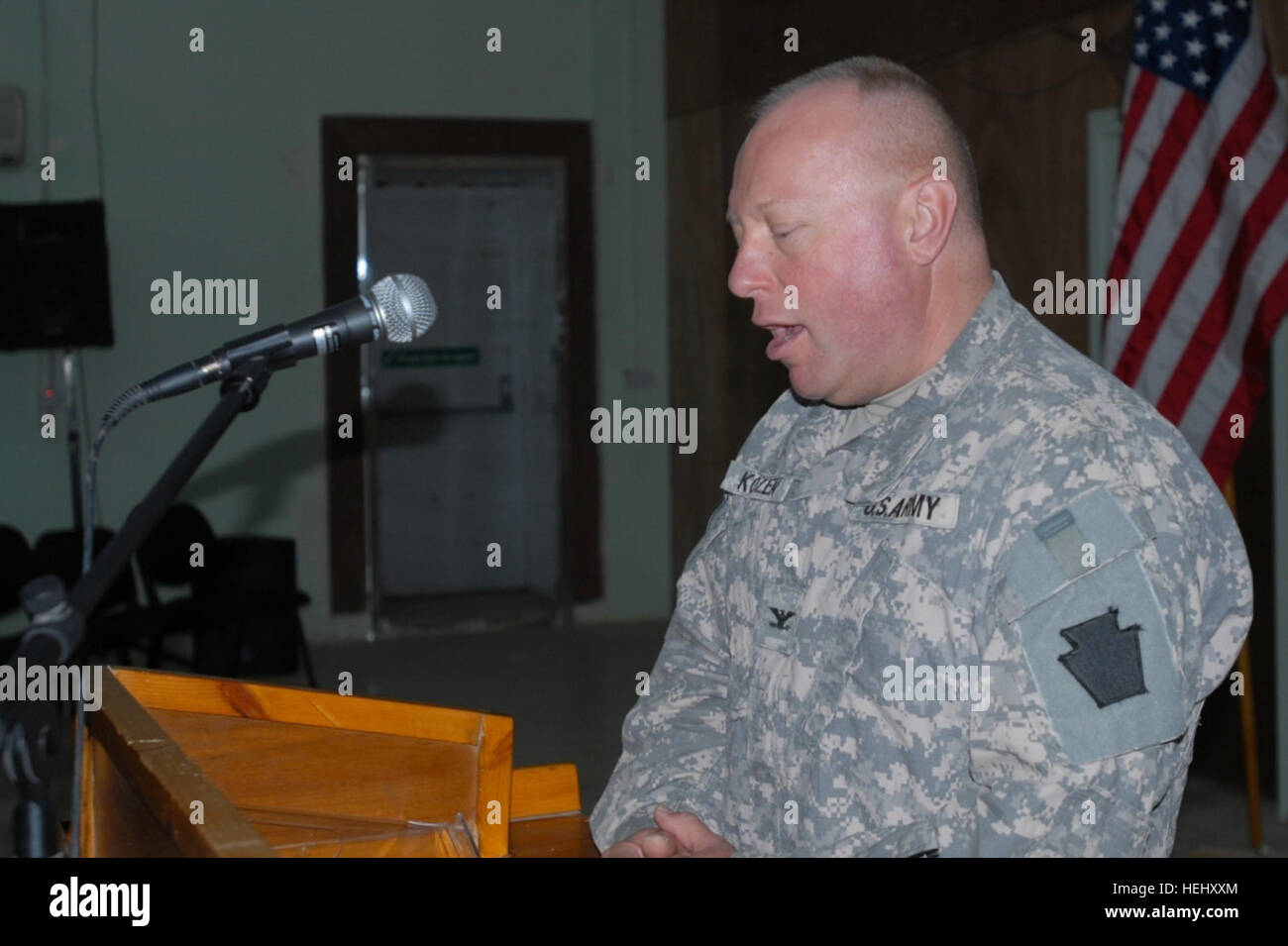 Col. Bert Kozen, brigade chaplain, from Williamsport, Pa., presides ...