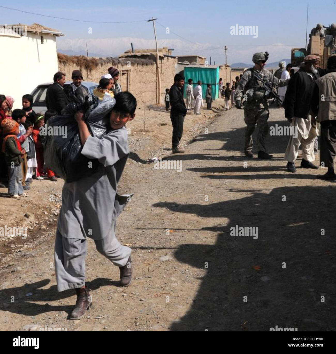 PARWAN PROVINCE, Afghanistan – An Afghan boy walks away with ...