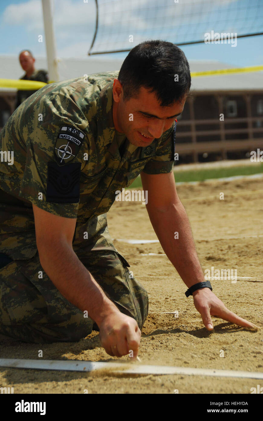 A Turkish Explosive Ordnance Disposal soldier probes for hidden 'mines ...