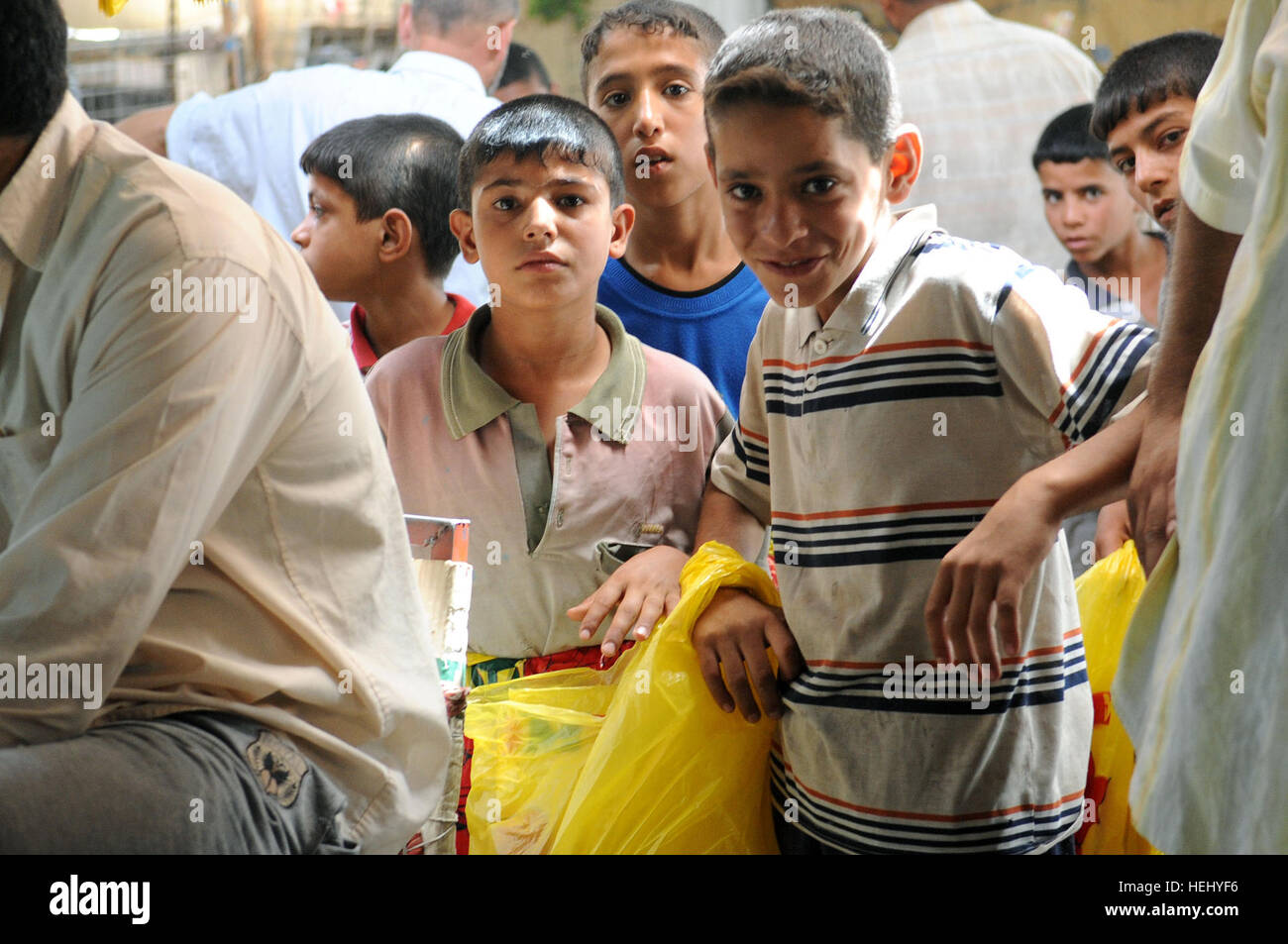 Iraqi boys watch Iraqi national police and U.S. Soldiers of 1st ...