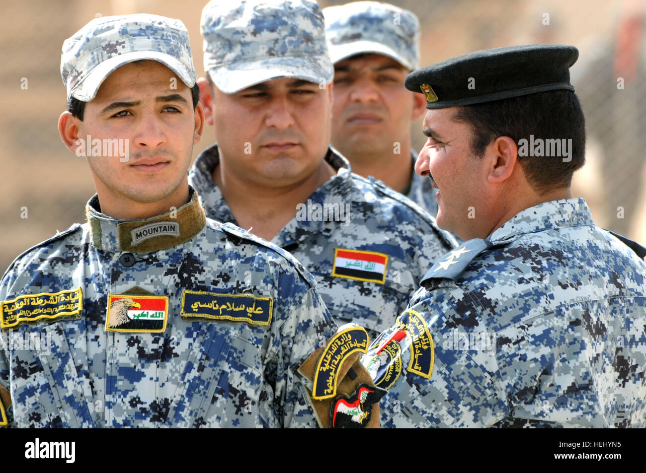 Iraqi national policemen are inspected by an Iraqi national police ...