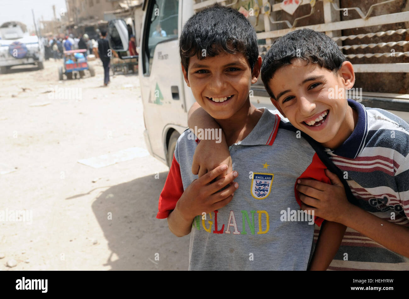 Iraqi boys smile for the camera in eastern Baghdad, Iraq, June 21. U.S ...