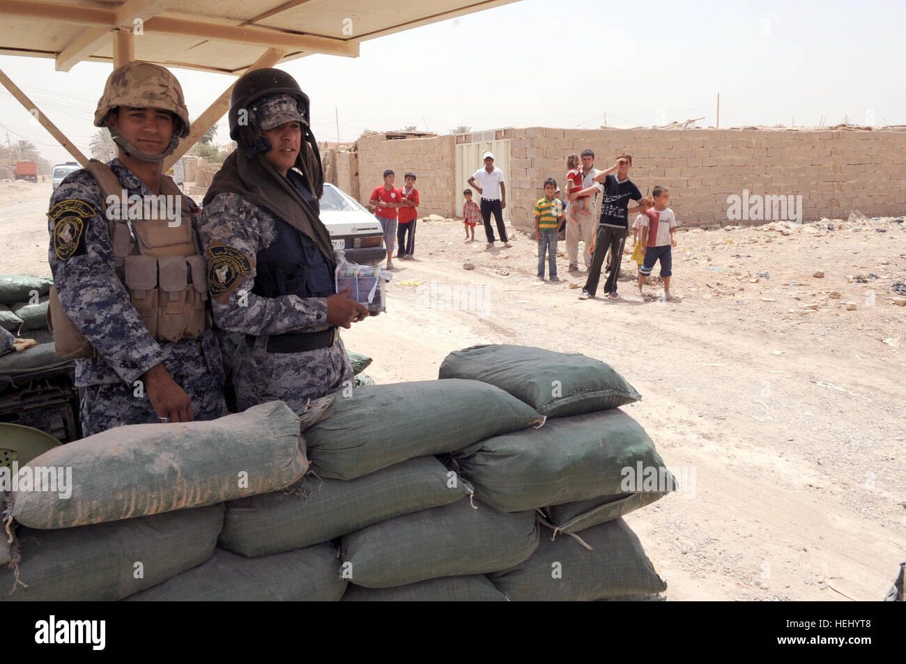Iraqi national policemen guard a checkpoint in eastern Baghdad, Iraq ...