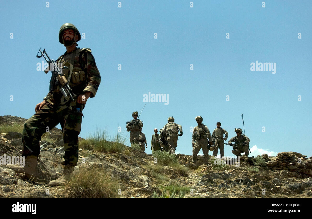 An Afghan national army soldier looks on, as members of 1st Platoon ...