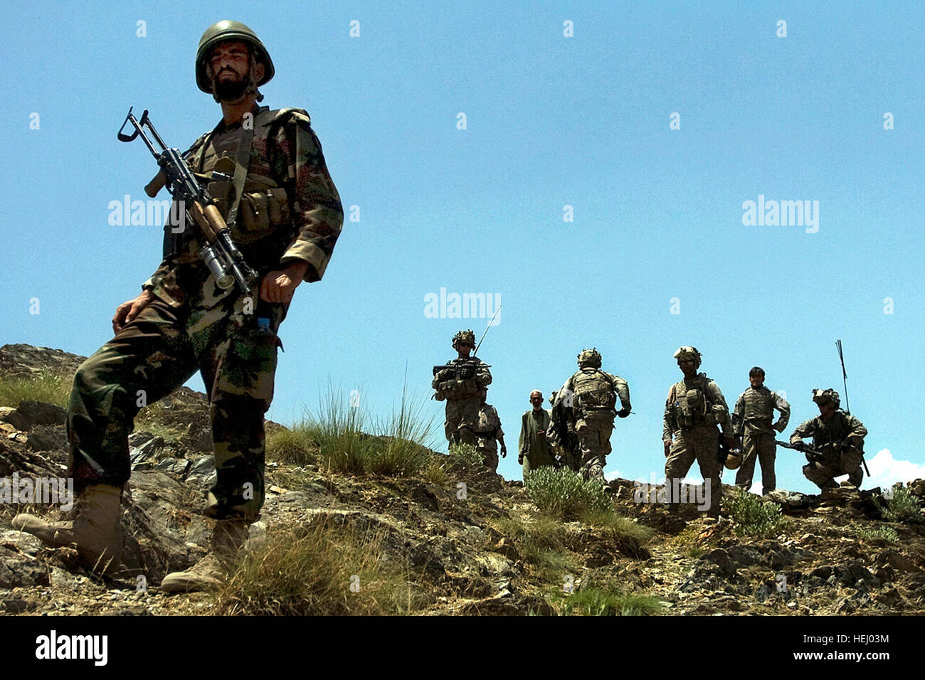 An Afghan National Army Soldier looks on, as members of 1st Platoon ...