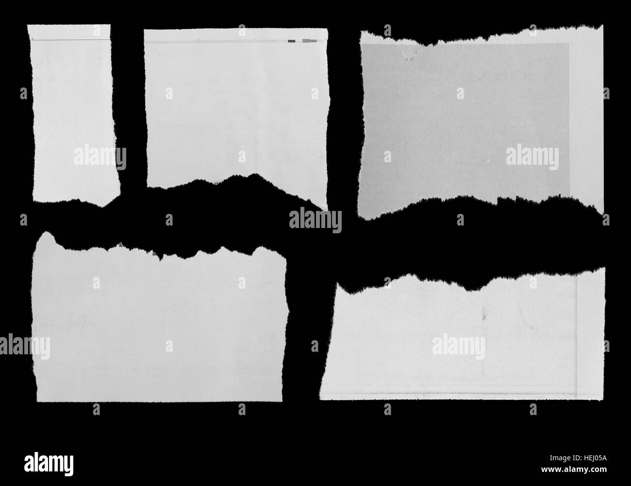 Pieces of torn paper on black Stock Photo - Alamy