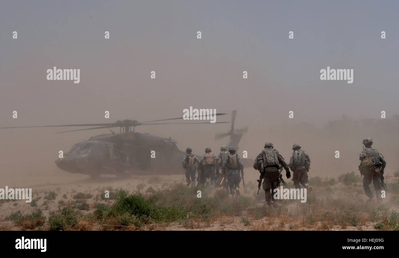 Iraqi national police and U.S. Soldiers mount a UH-60 Black Hawk after ...